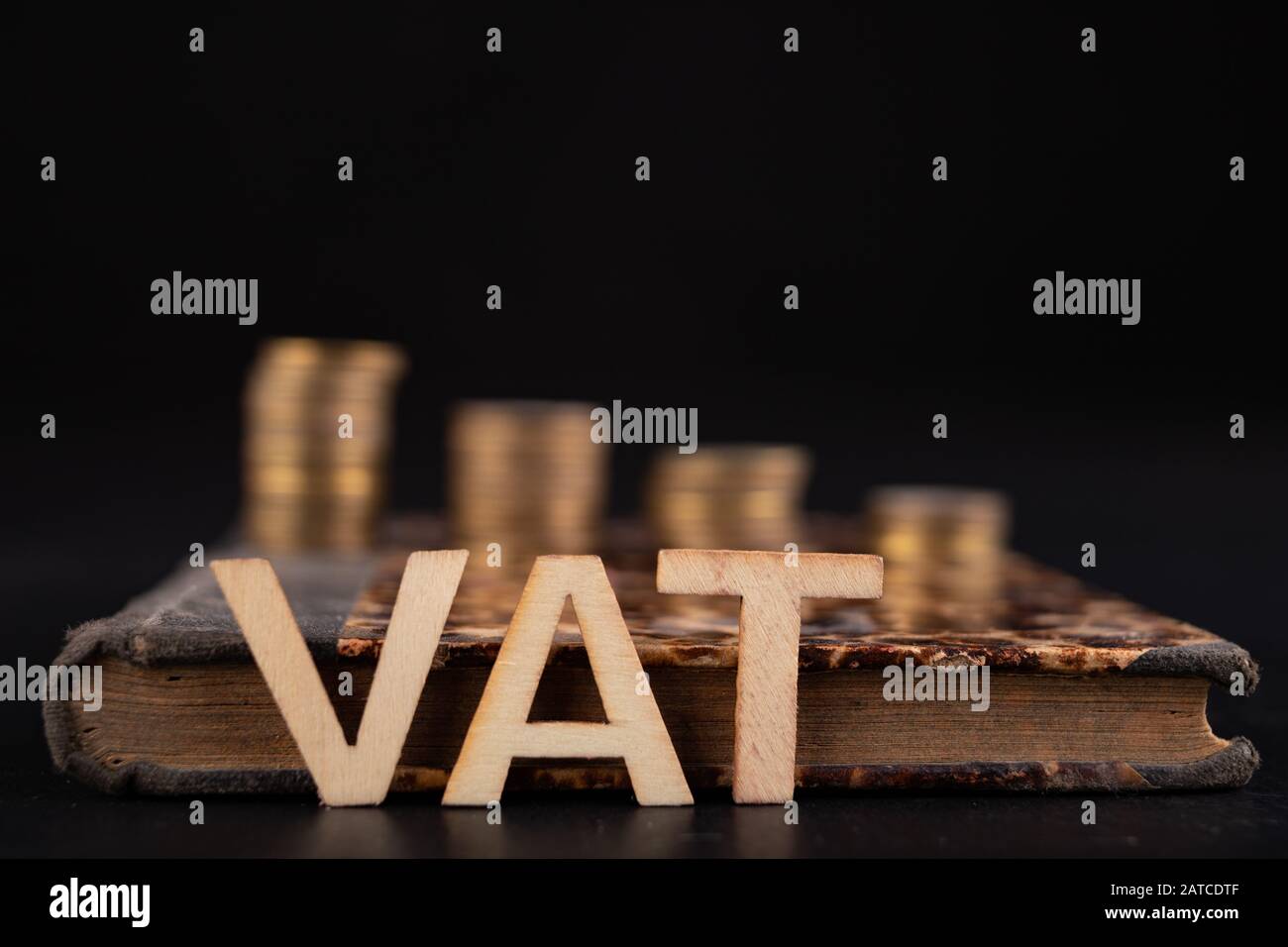 The word vat arranged from wooden letters on the background of the old ...