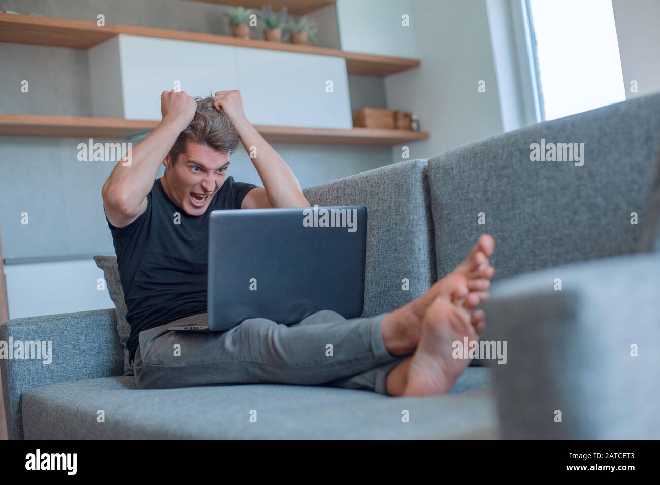 close up. young man rooting for his team Stock Photo - Alamy