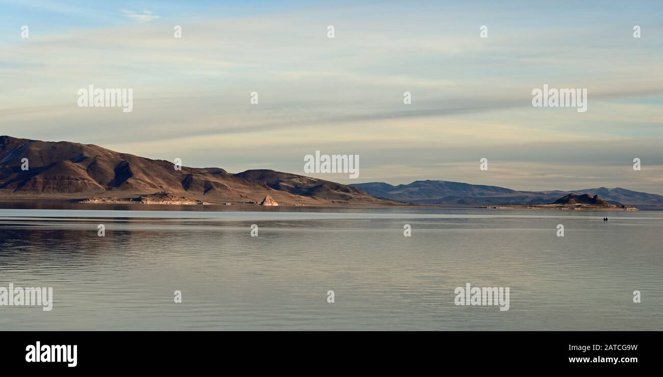 Rock formations and reflections of Pyramid Lake, Nevada on clear ...