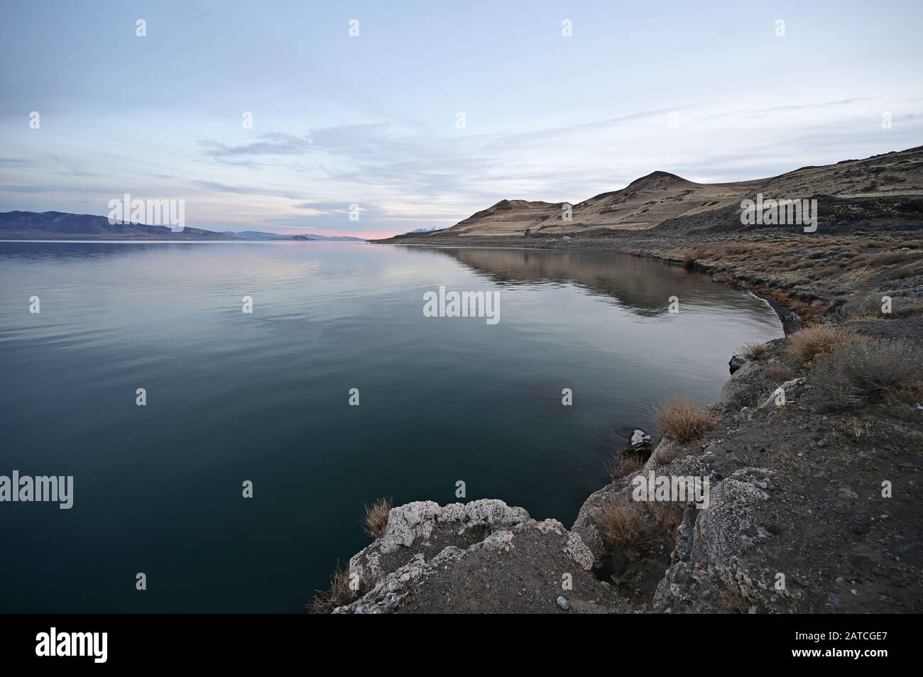Rock formations and reflections of Pyramid Lake, Nevada on clear ...