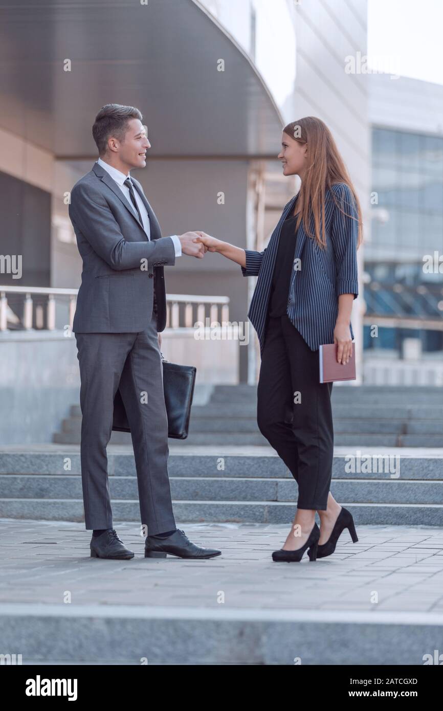 young people greeting each other in front of the office building Stock ...