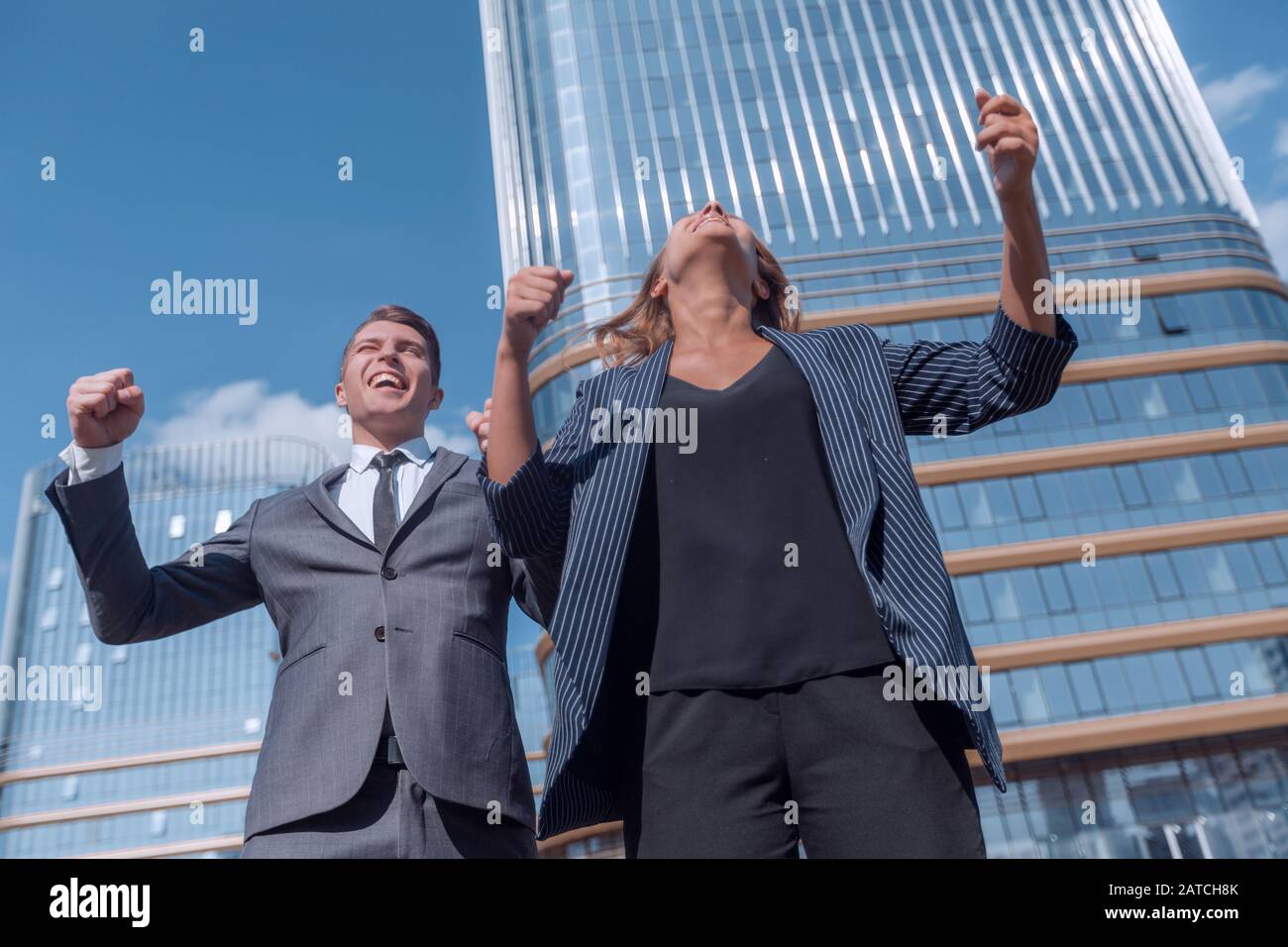 happy young people on the background of an office building Stock Photo - Alamy