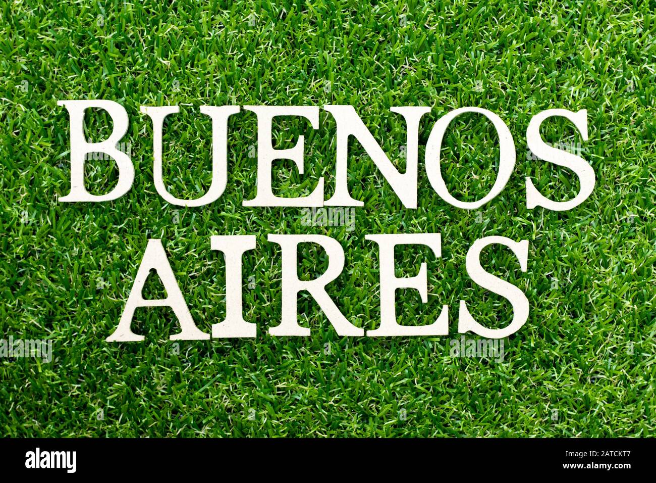 Wood alphabet letter in word Buenos Aires on green grass background ...