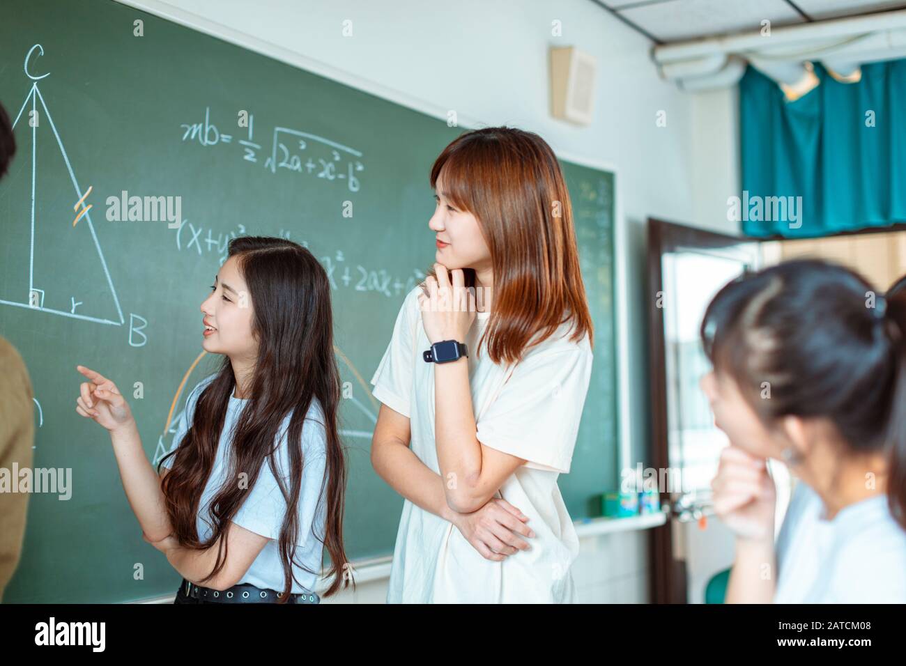 Group of students working on the mathematical problem Stock Photo - Alamy