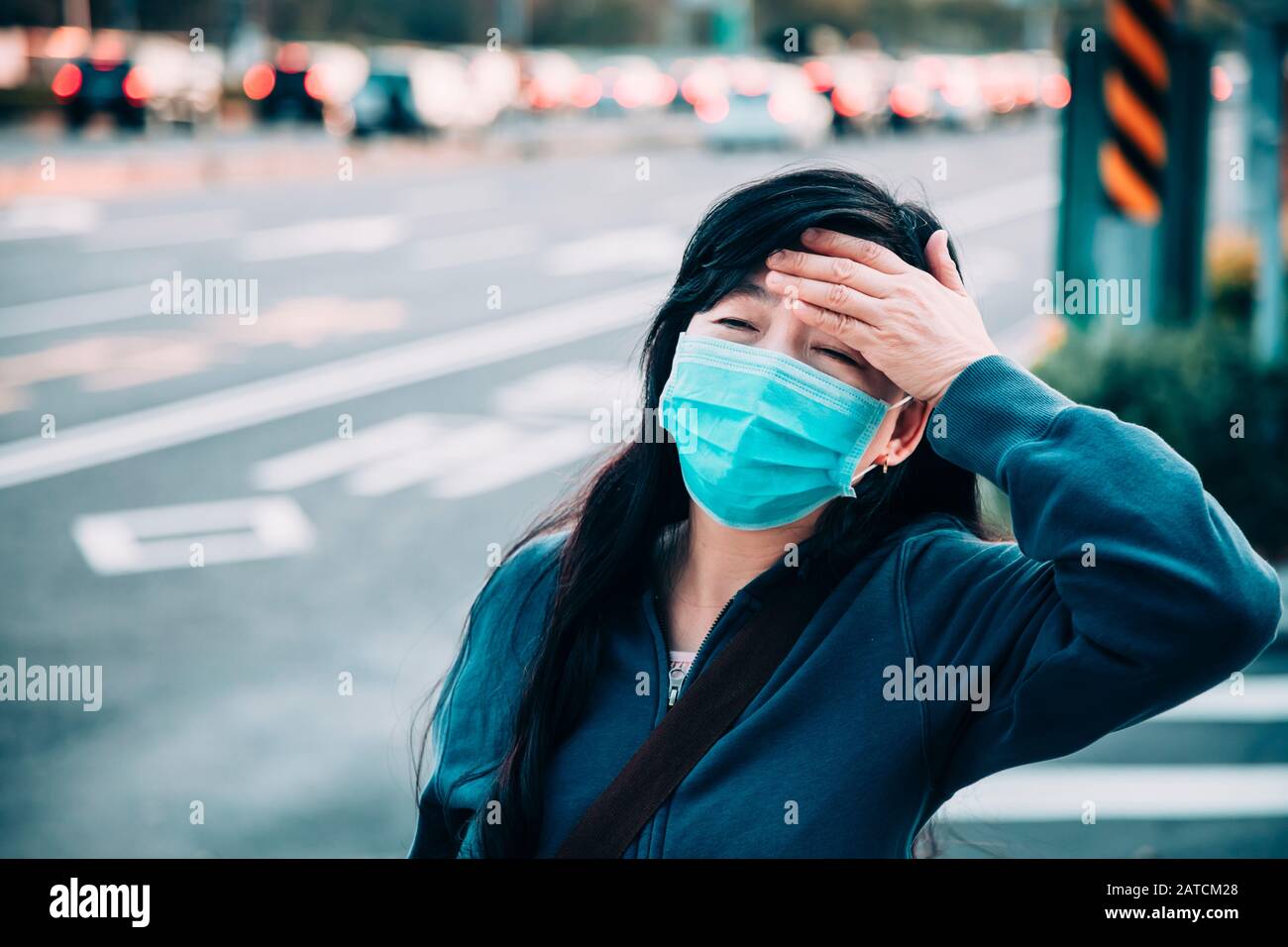 Sick woman with cold and flu walking on the street Stock Photo - Alamy