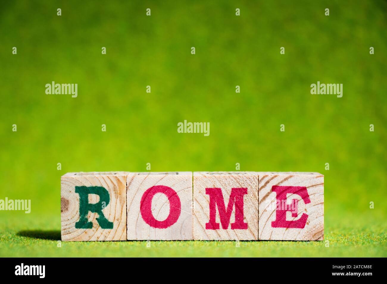 Letter block in word rome on artificial green background Stock Photo ...