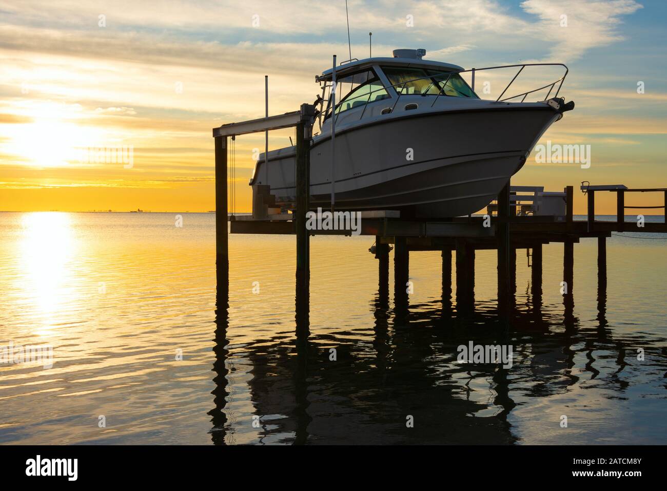 Expensive fishing boat on electric motorized dock vessel lift during ...