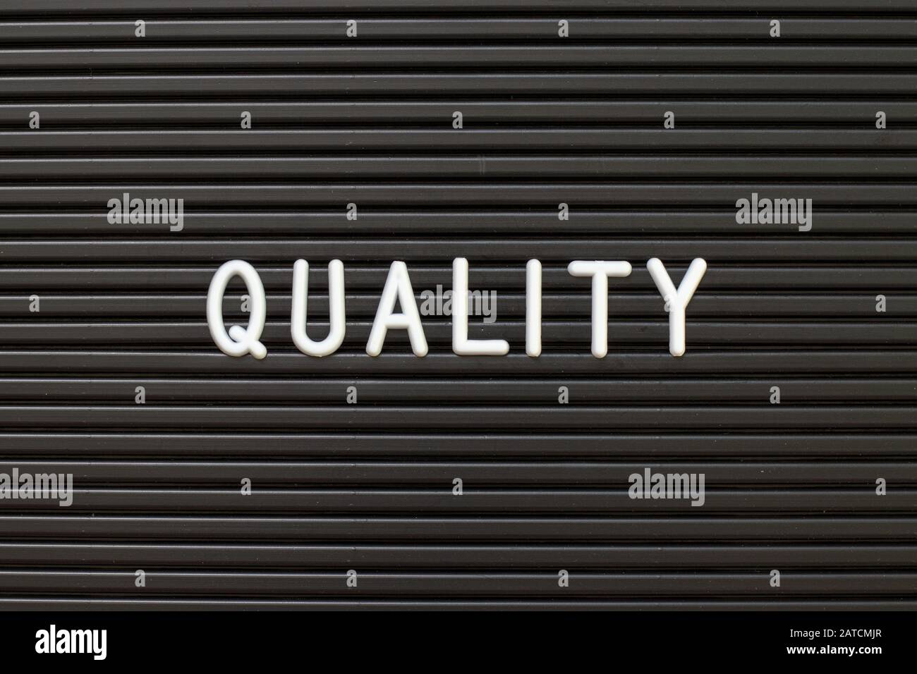 Black color felt letter board with white alphabet in word quality ...