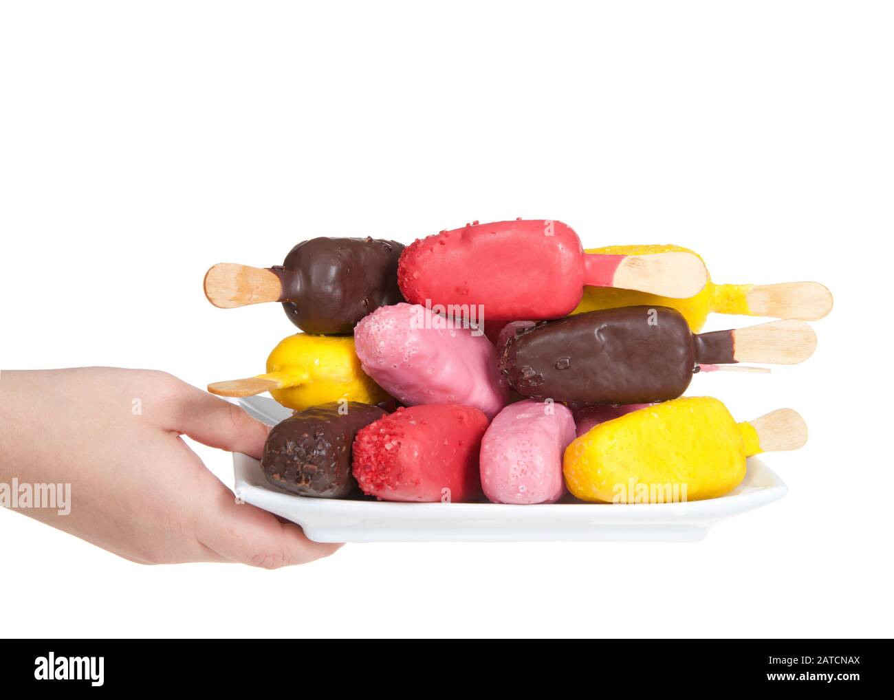 Hand holding cake pop Cut Out Stock Images & Pictures - Alamy