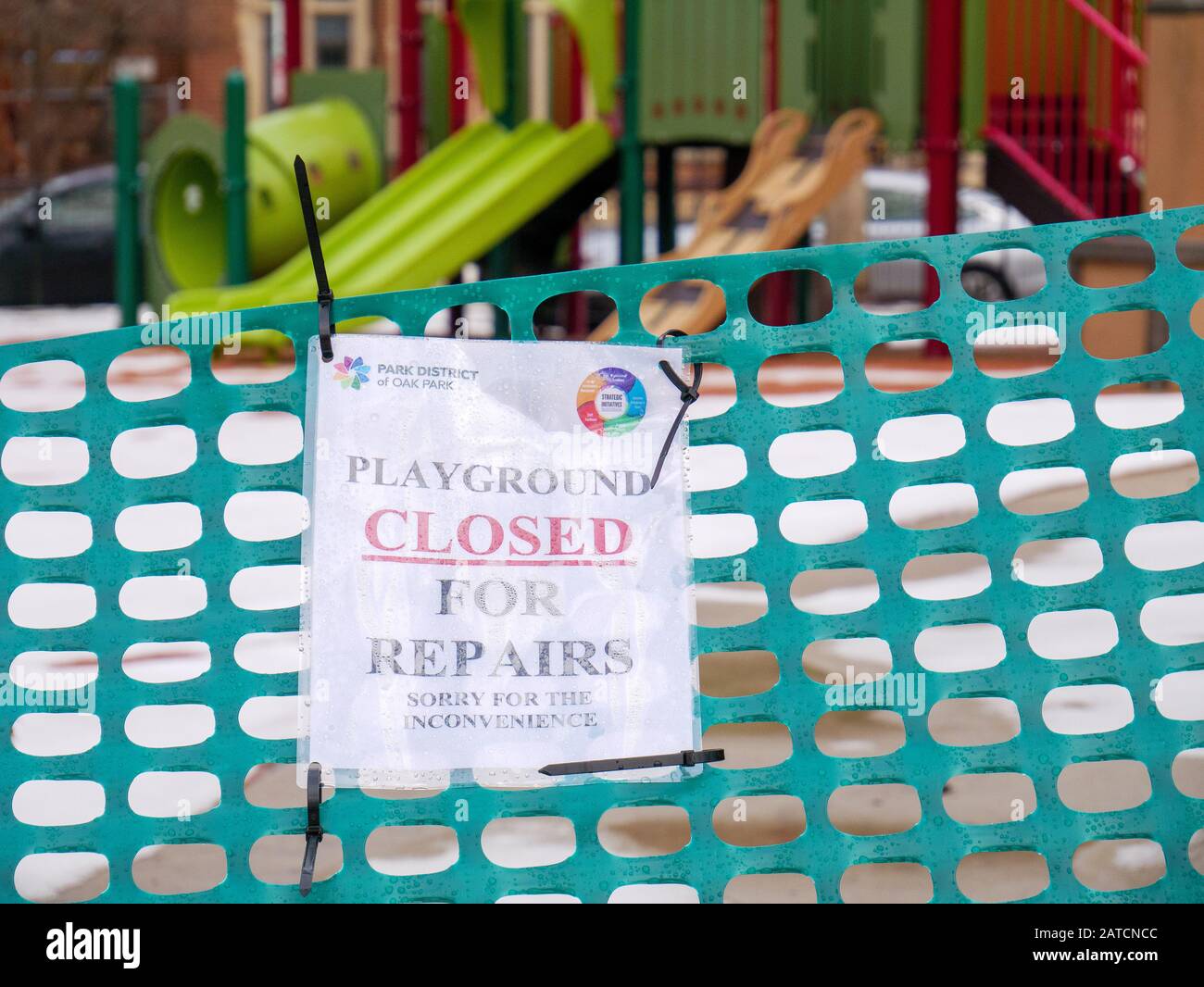 Playground closed for repair sign Stock Photo - Alamy