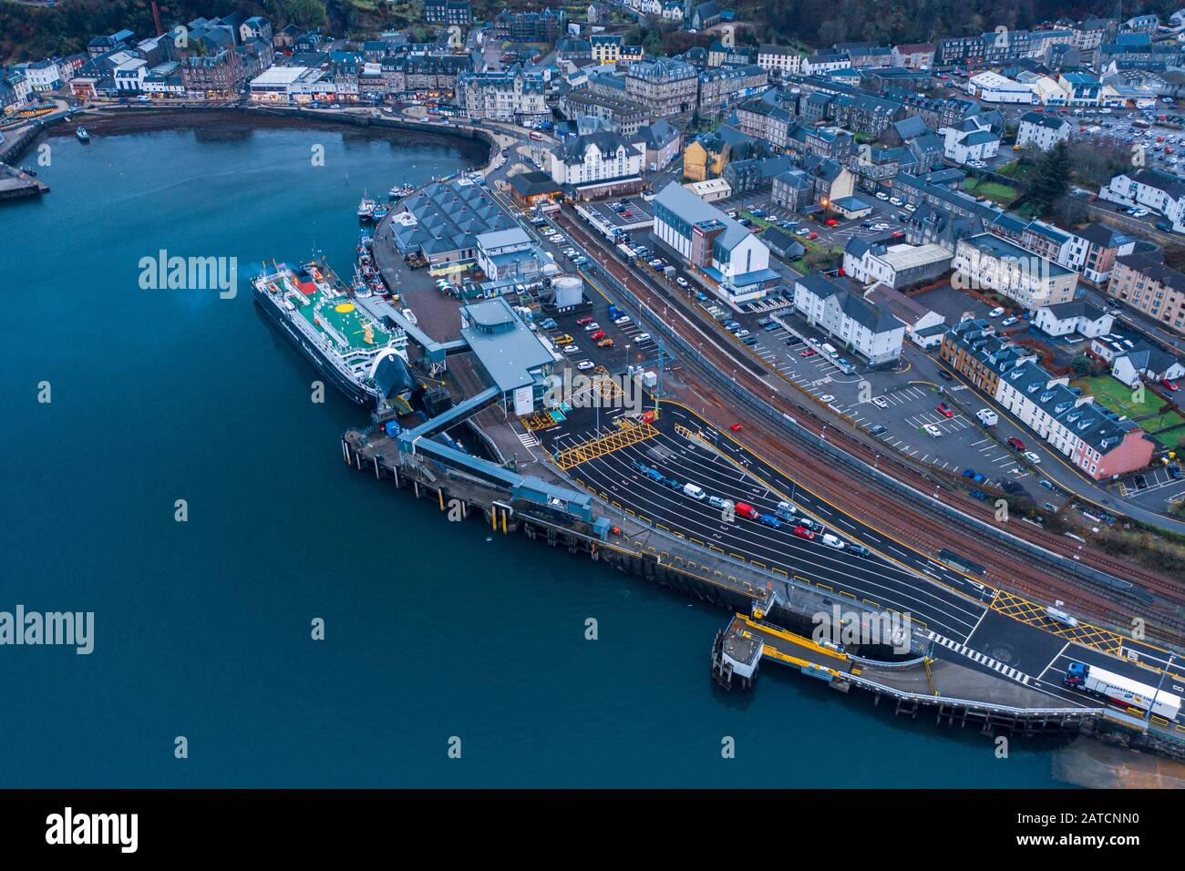 High altitude drone shoot over scenic harbour with ferry terminal of ...