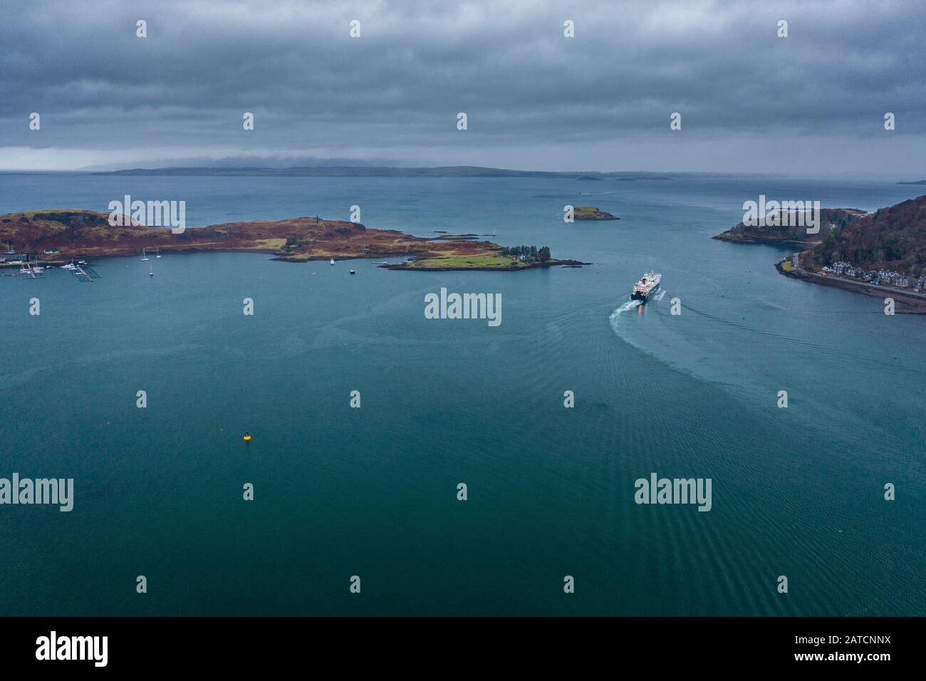 Crossing ferry passing by Kerrera Island of the scenic harbour of Oban ...