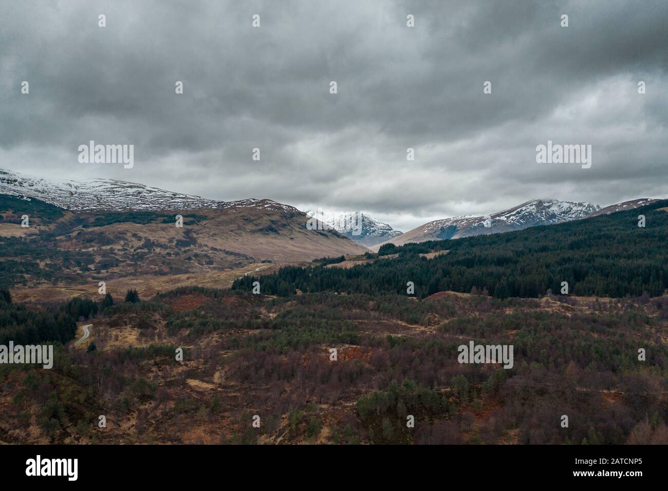 Snowy mountain range in Scottish Highlands at winter - drone point of ...