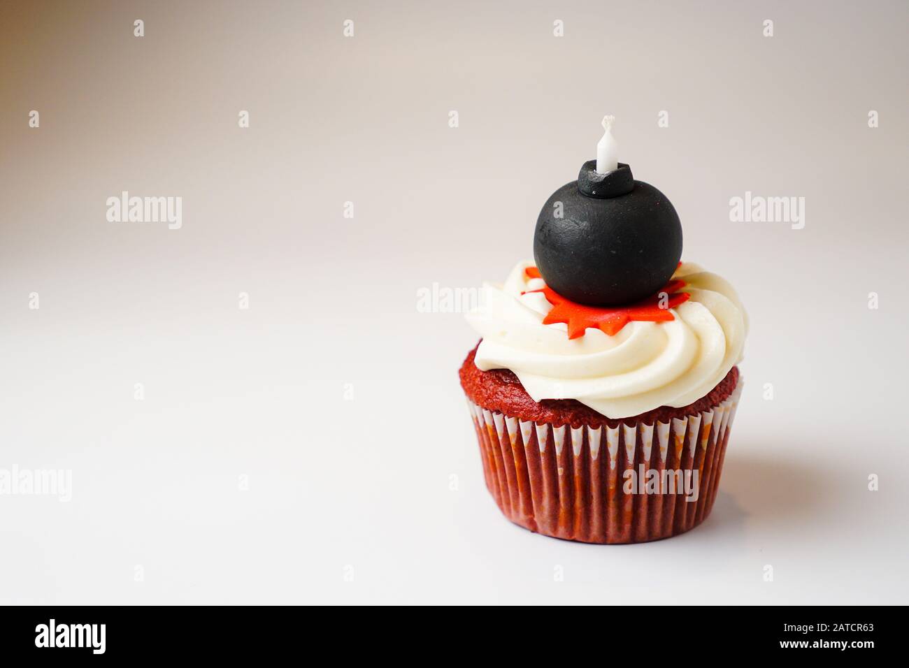 Cupcake decorated with candy bomb Stock Photo - Alamy