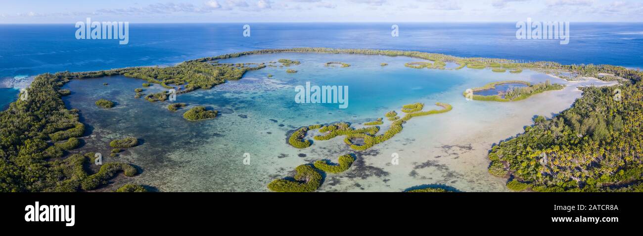 A remote tropical island in the Molucca Sea is fringed by mangrove ...