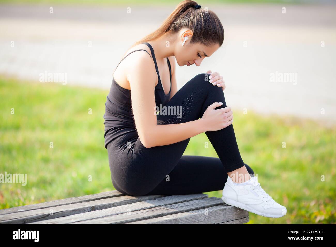 Woman Suffering From Pain In Leg After Workout Stock Photo - Alamy