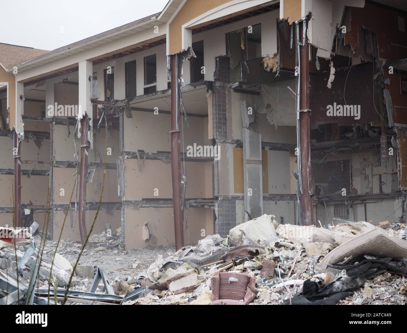 Photo of buildings being demolished and a pile of rubble on the ...
