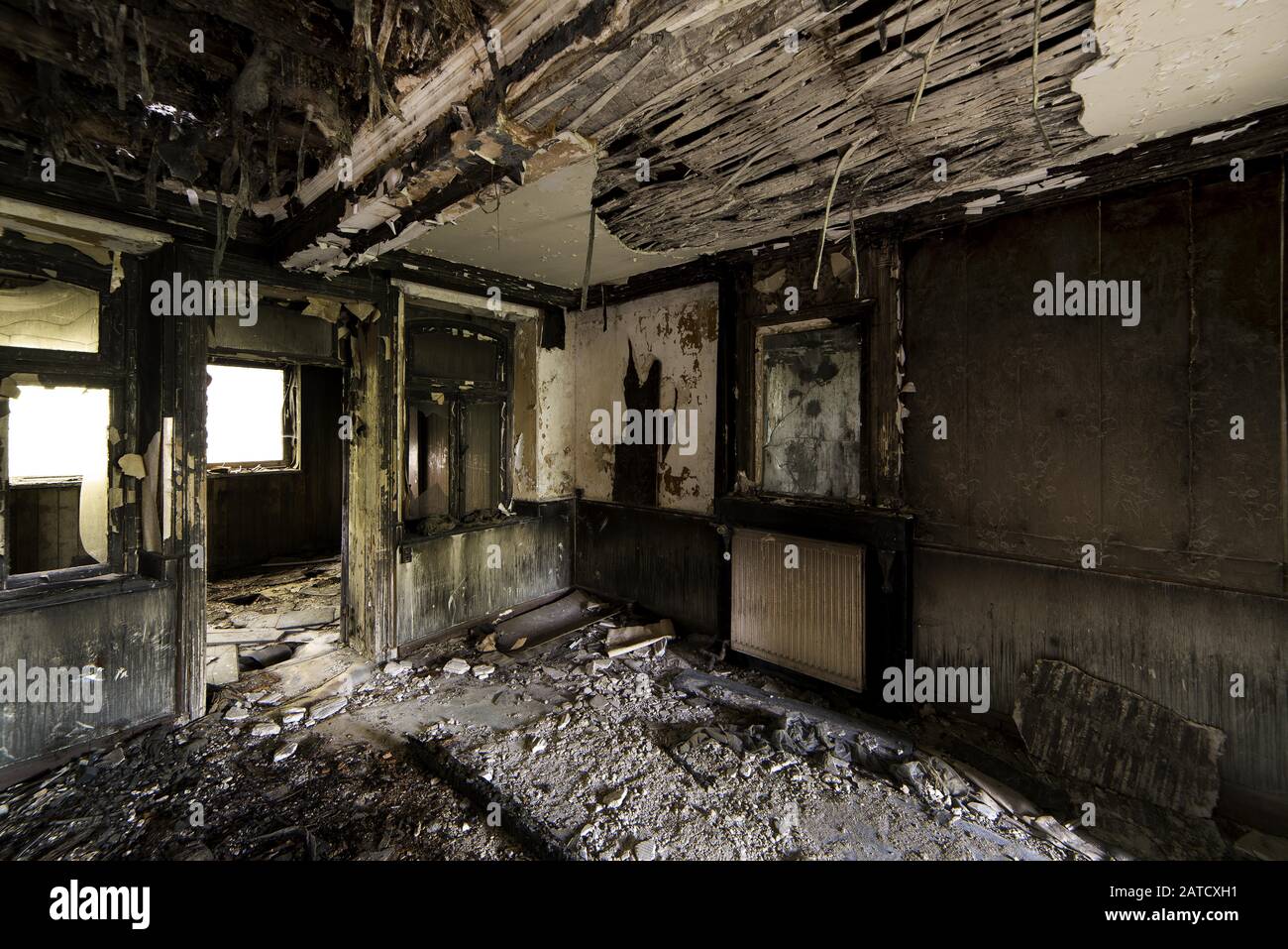 Inside shot of an abandoned destroyed building with burned walls and ...
