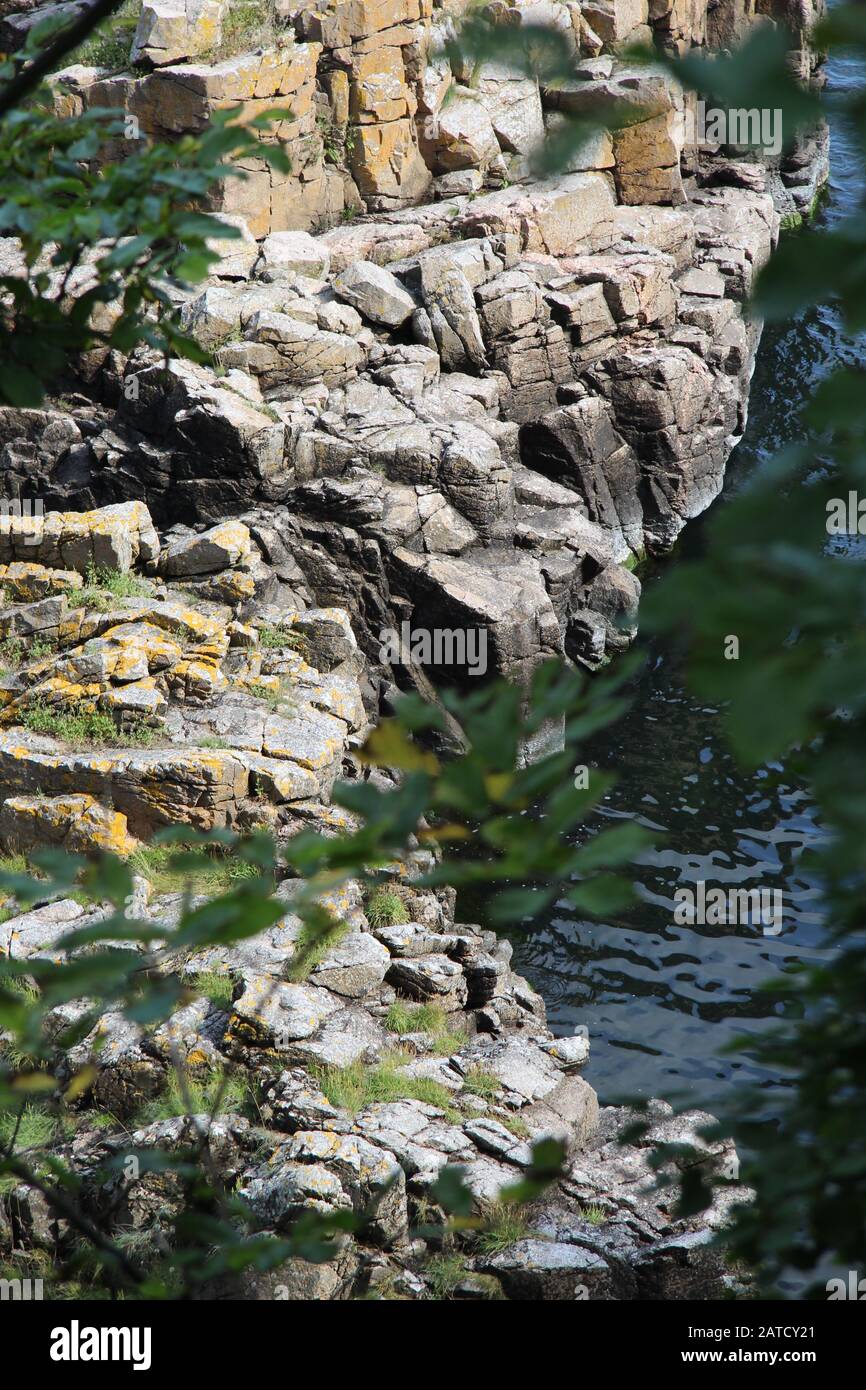 High angle shot of a river cliff with good diving spots Stock Photo - Alamy