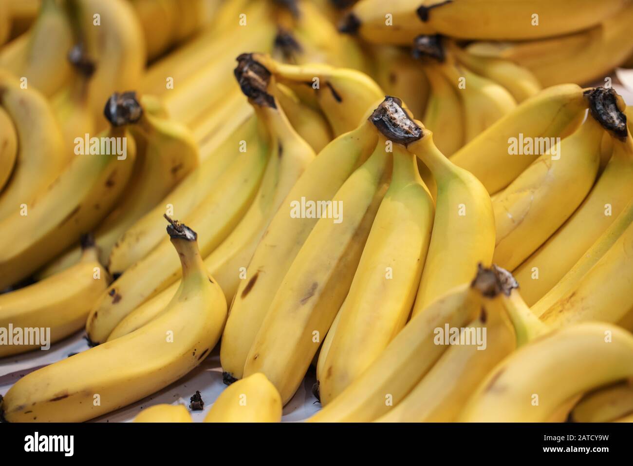 bunches of yellow bananas on display in a fruit market store Stock ...