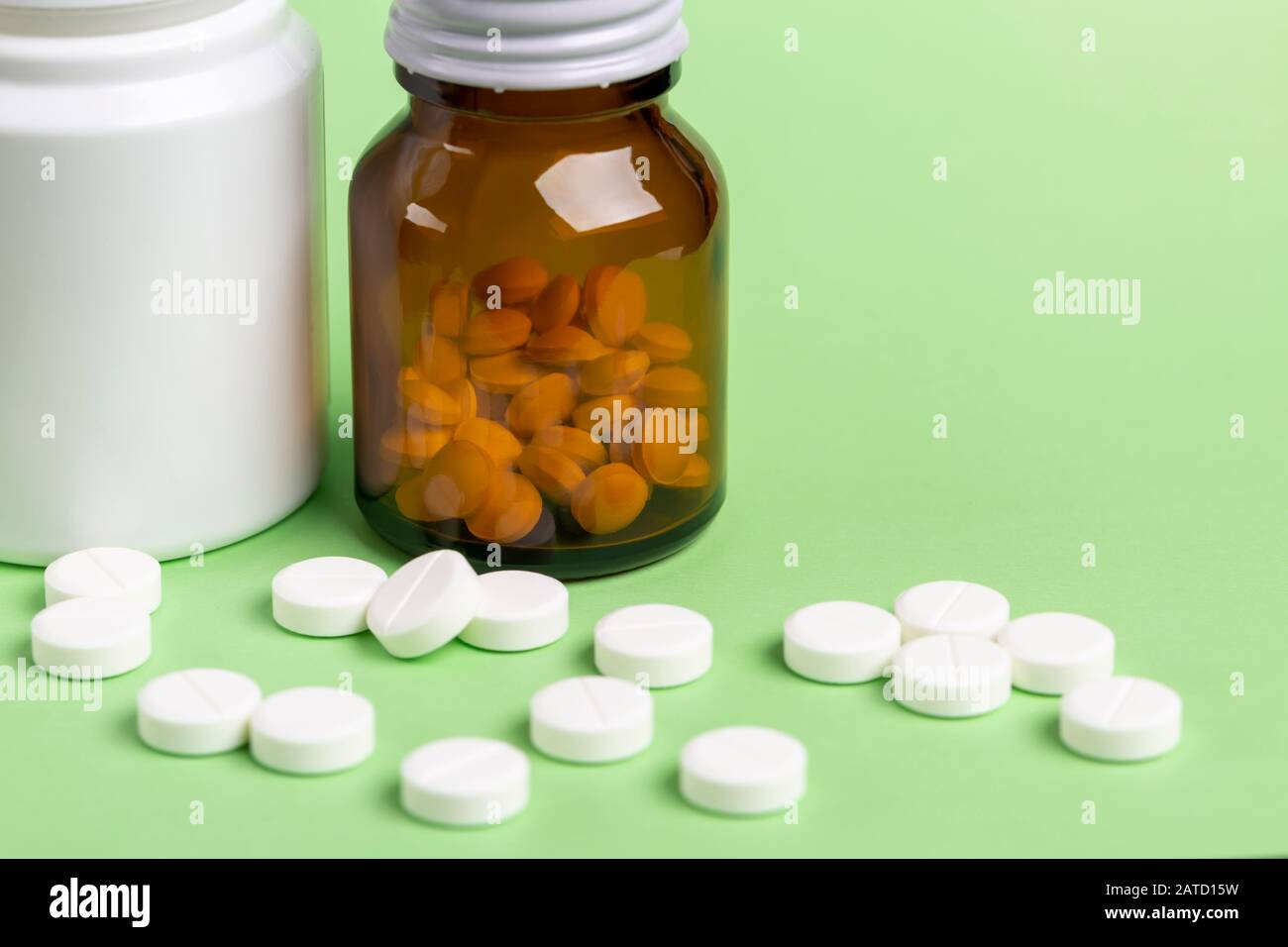 Glass and plastic pill bottles with white tablets inside Stock Photo ...