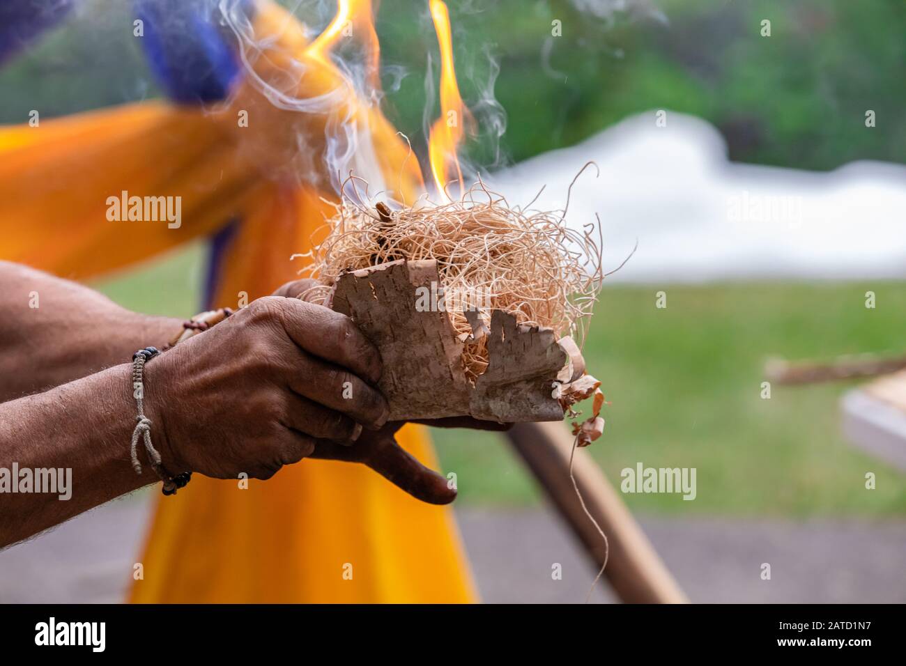 Closeup image of man hands of male with dirty hands carrying burning ...