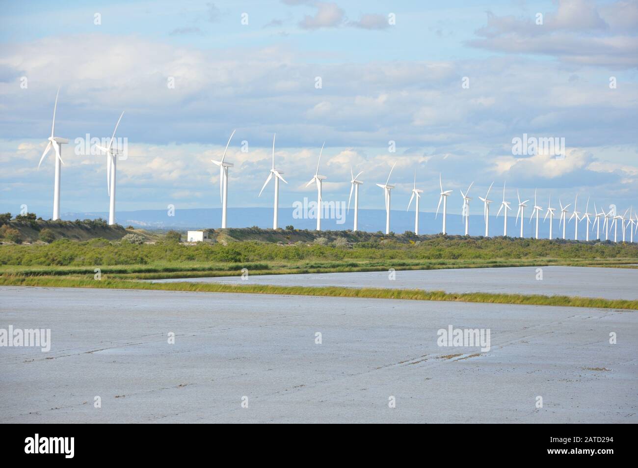 landscape filled with wind turbine in the Camargue, France. new ...