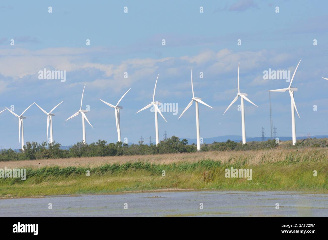 landscape filled with wind turbine in the Camargue, France. new ...