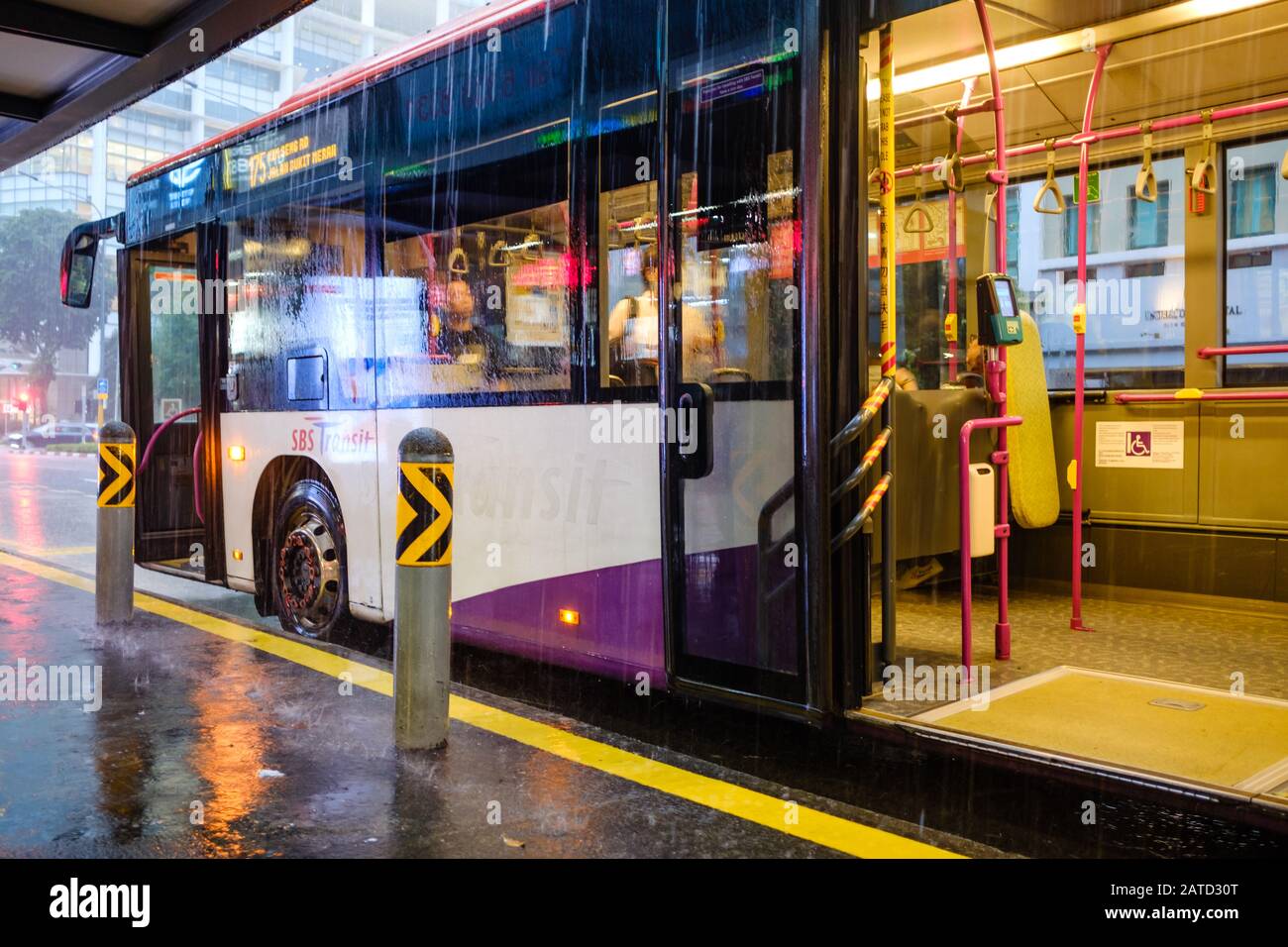 Singapore-29 JAN 2020:Singapore public bus in bus stop in rain day ...