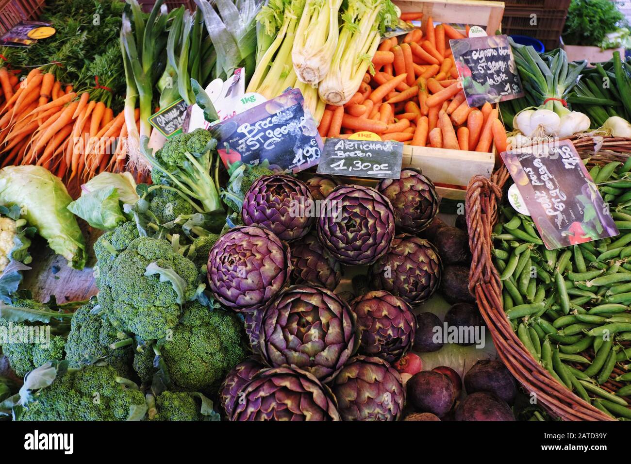 Locally grown fresh vegetables, artichokes, peas, carrots, and shallots ...