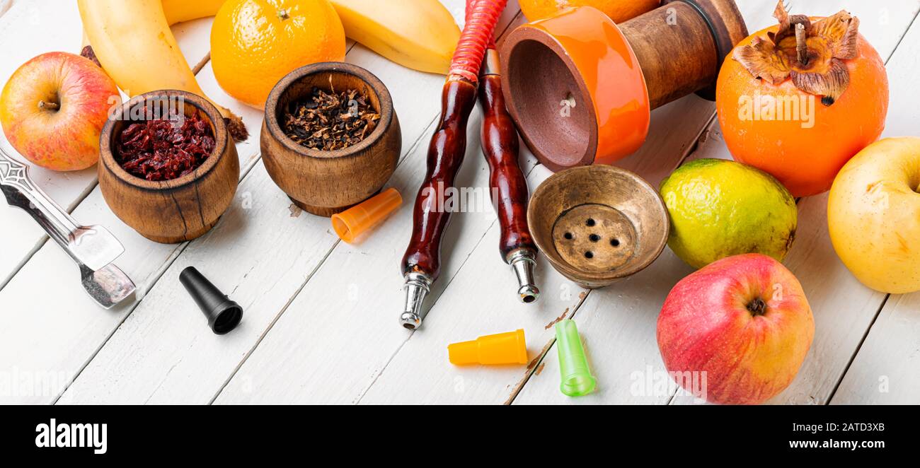 Smoking hookah for relaxation.Details of a hookah and fruit smoking ...