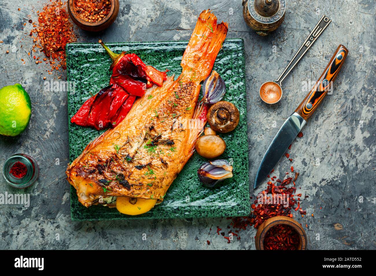 Red sea bass baked with mushrooms and red pepper.Fish in roasted ...