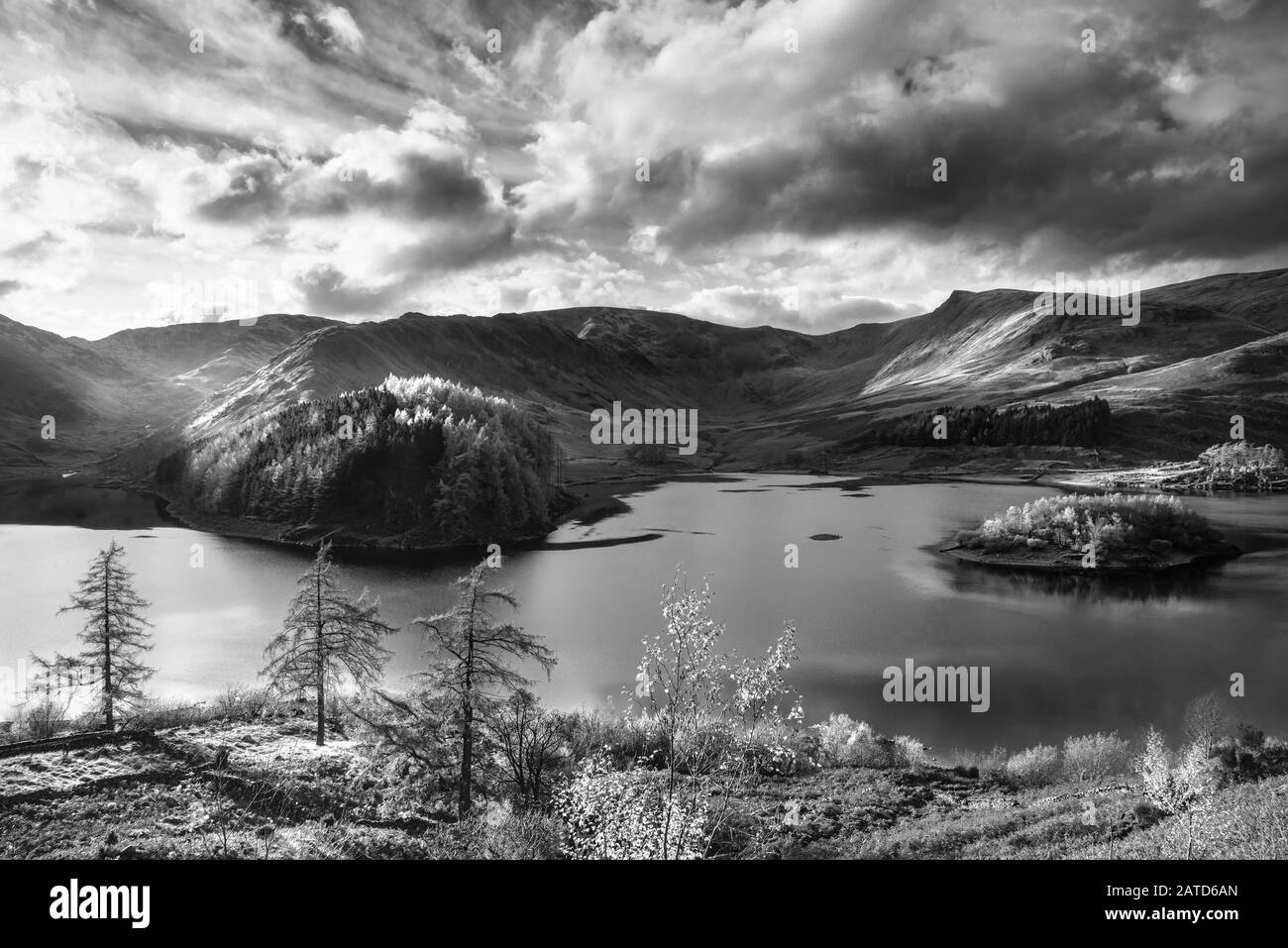 Epic Autumn Fall landscape of Hawes Water with epic lighting and ...