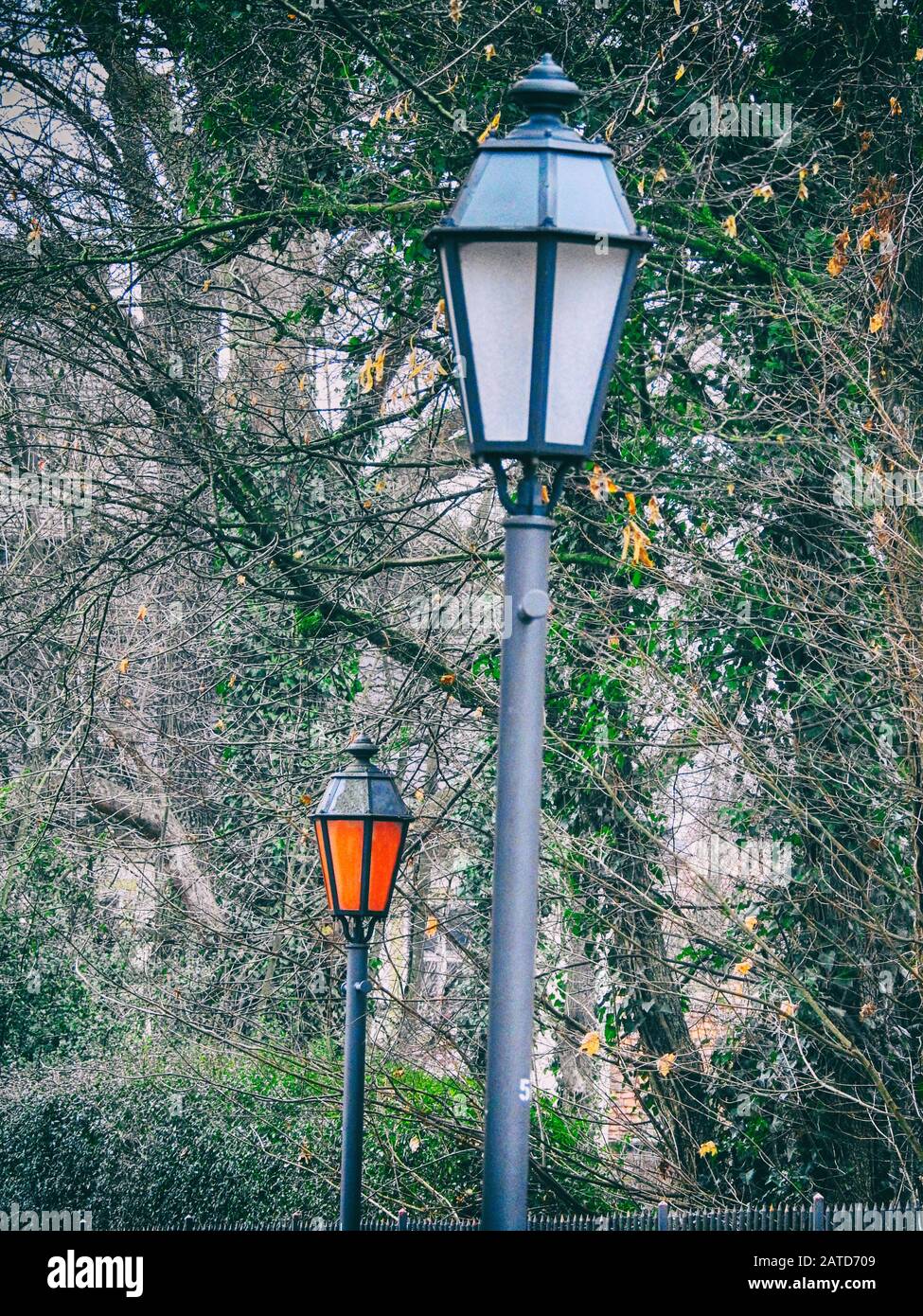 Two different looking lamp posts Stock Photo - Alamy
