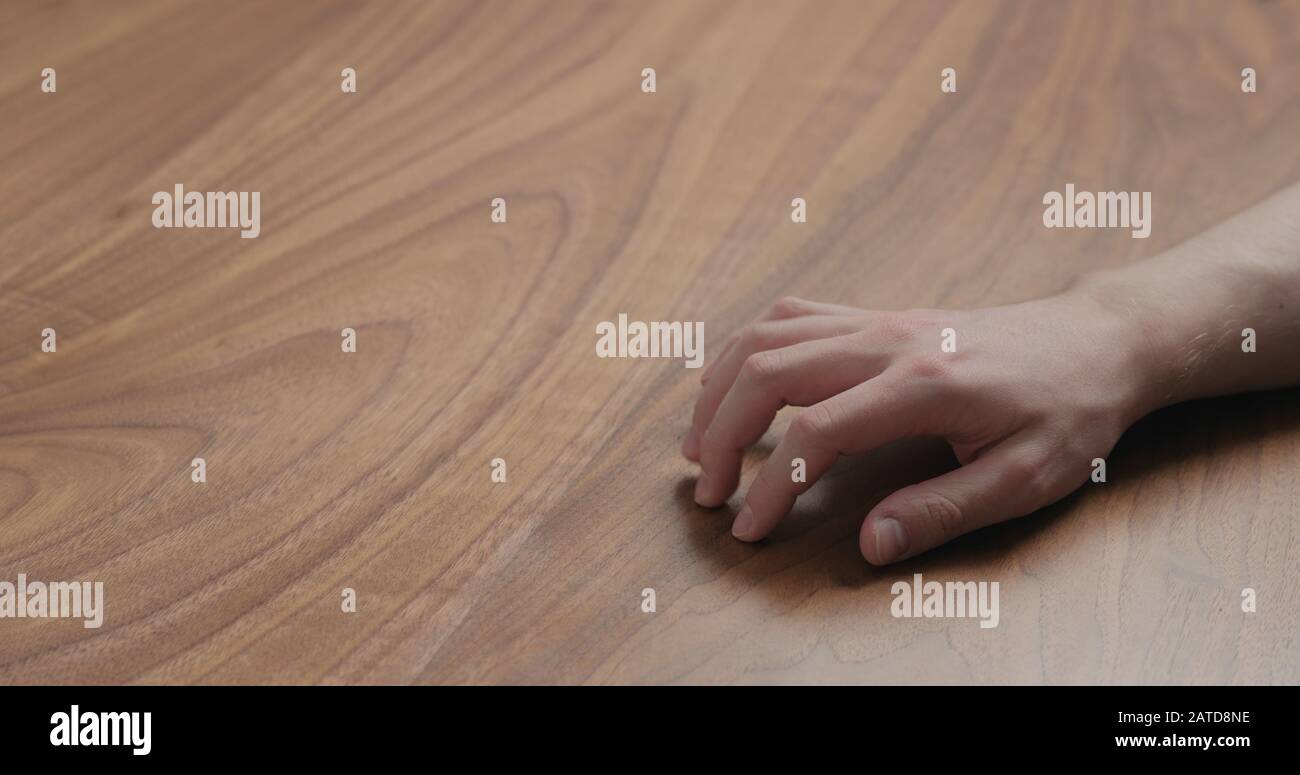man hand finger tapping on black walnut table, wide photo Stock Photo ...
