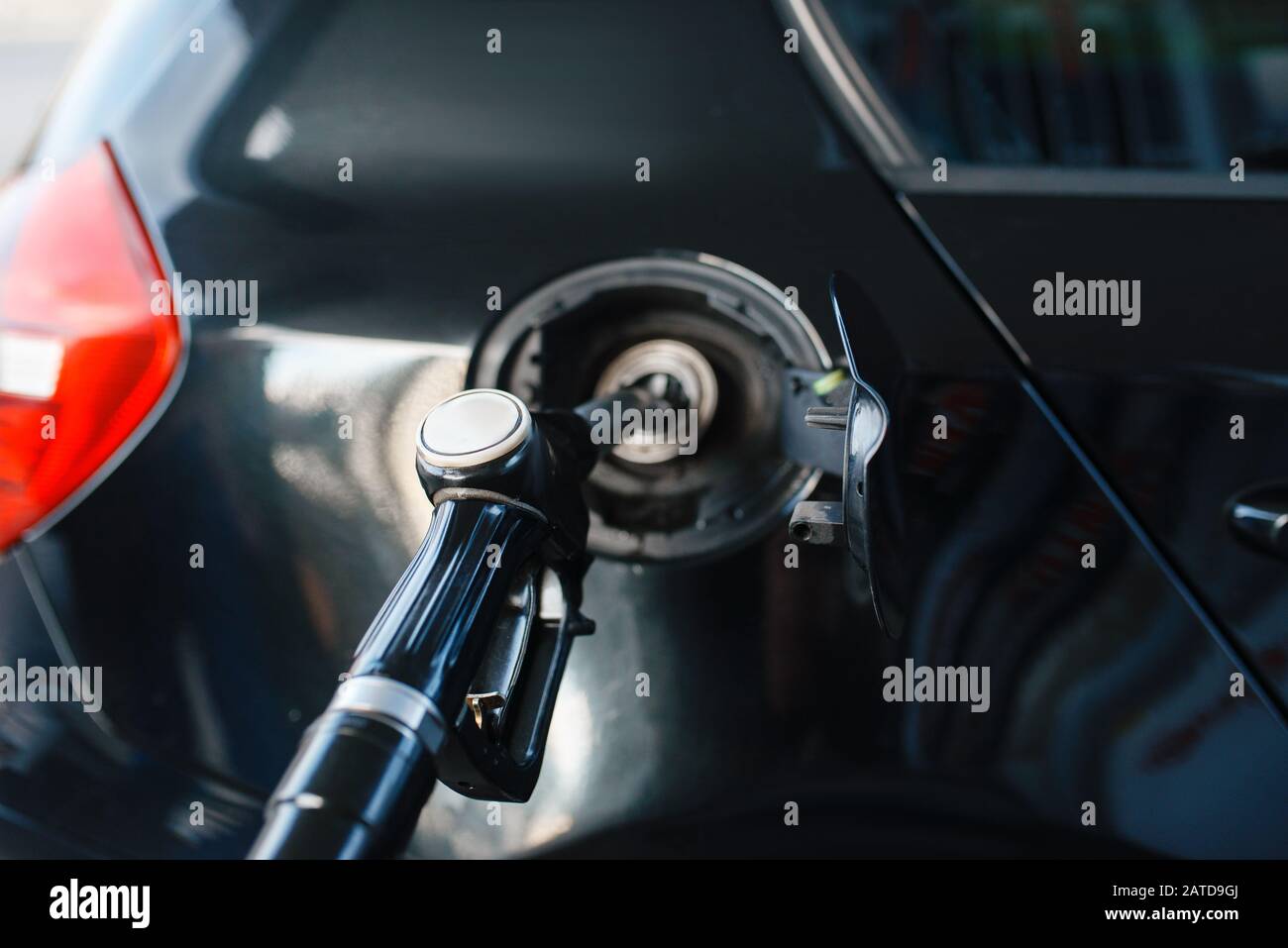 Car with gun in tank fueling on gas station Stock Photo - Alamy
