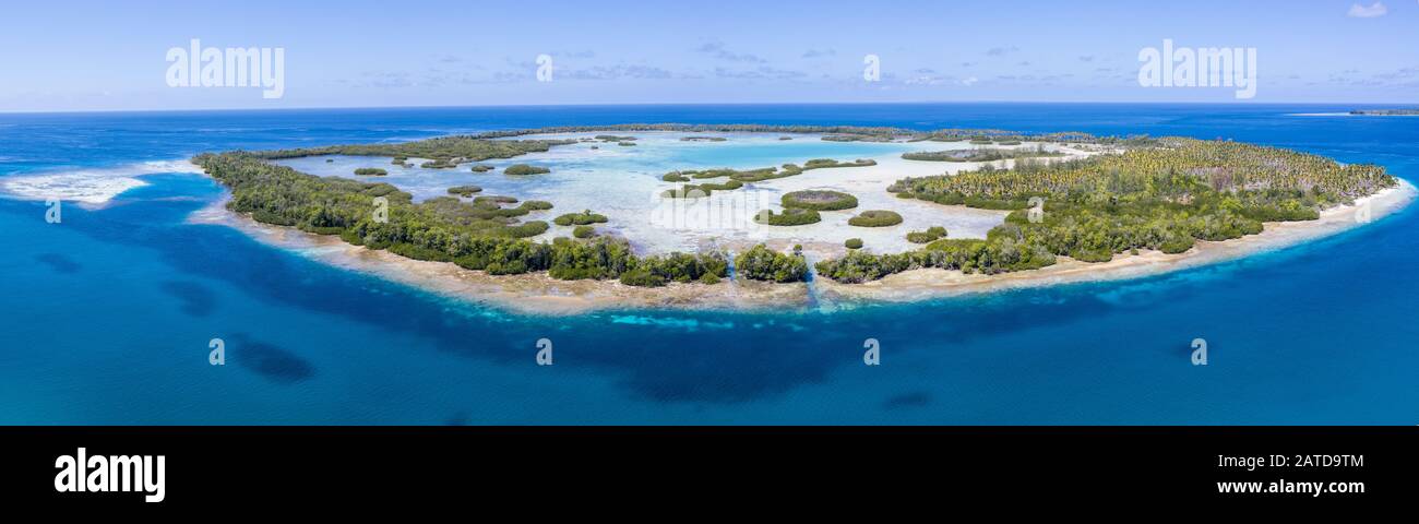 A remote tropical island in the Molucca Sea is fringed by mangrove ...