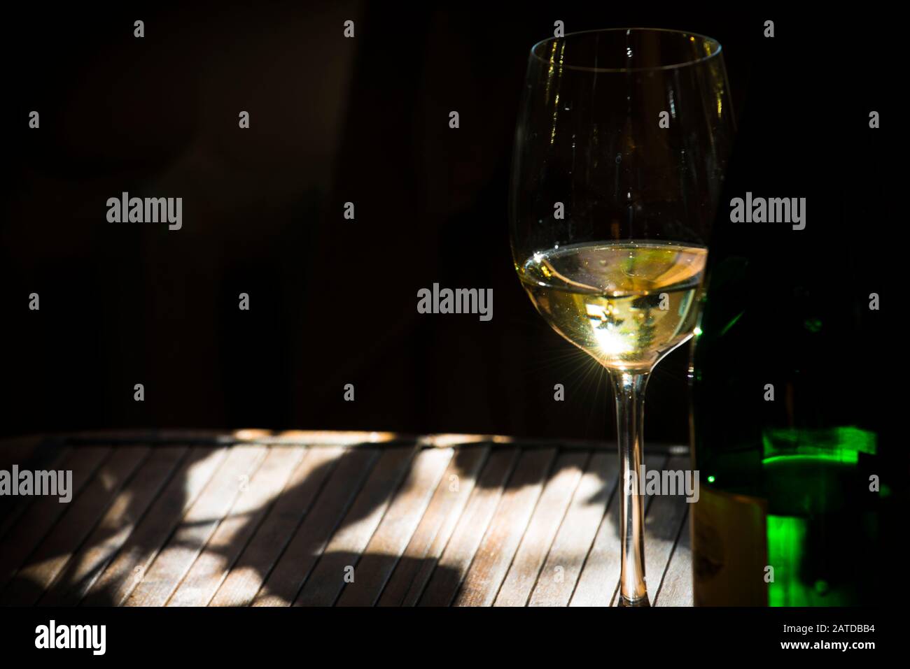 A glass of white riesling wine, with natural light glare Stock Photo ...