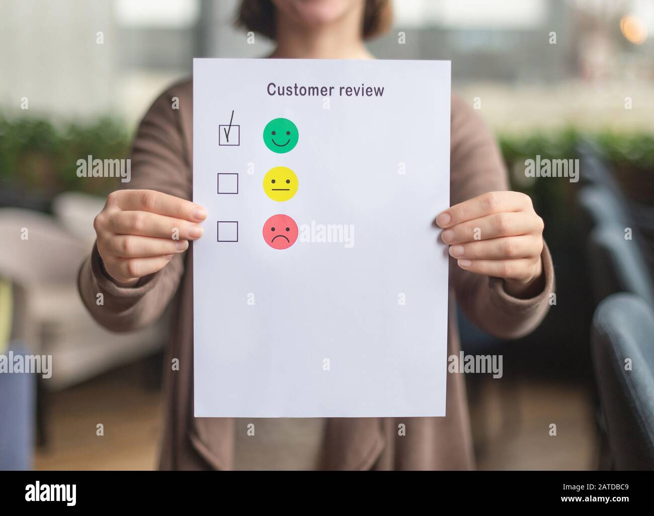 Hand holding smiley face emoticon hi-res stock photography and images ...