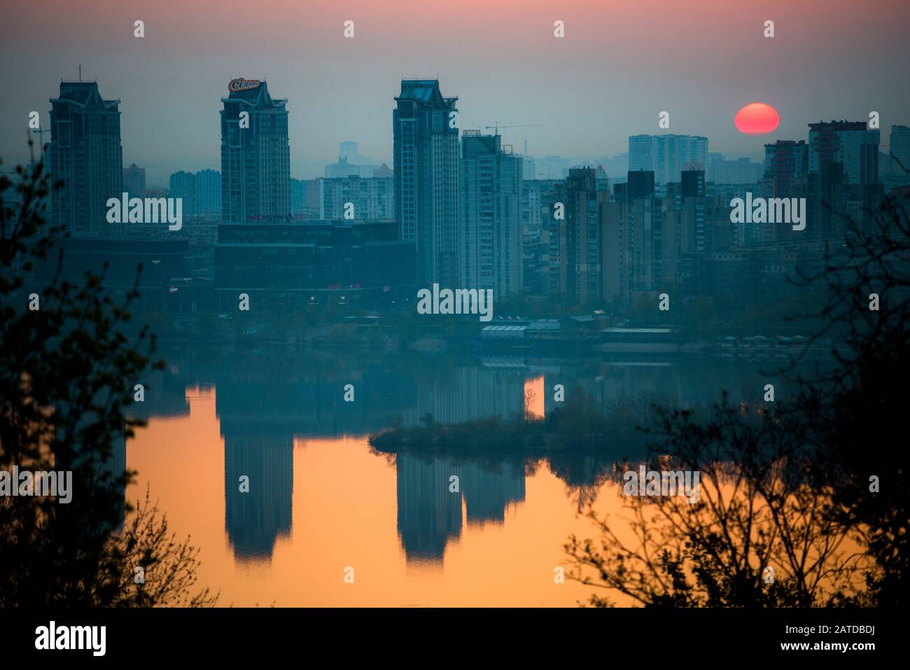 A view of Kyiv, at sunrise, with silhouettes of the left bank ...
