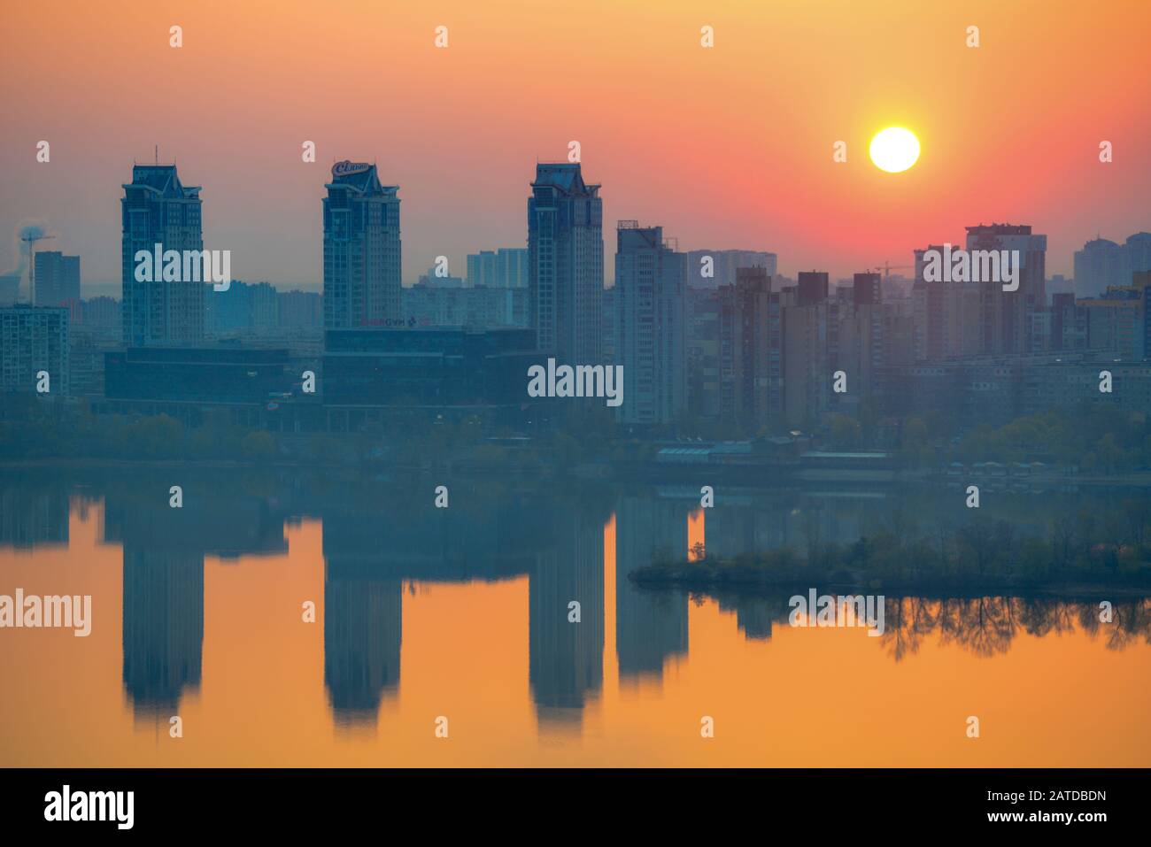 A view of Kyiv, at sunrise, with silhouettes of the left bank ...