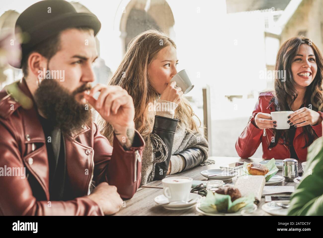Trendy friends drinking coffee at bar cafe - Young people doing ...