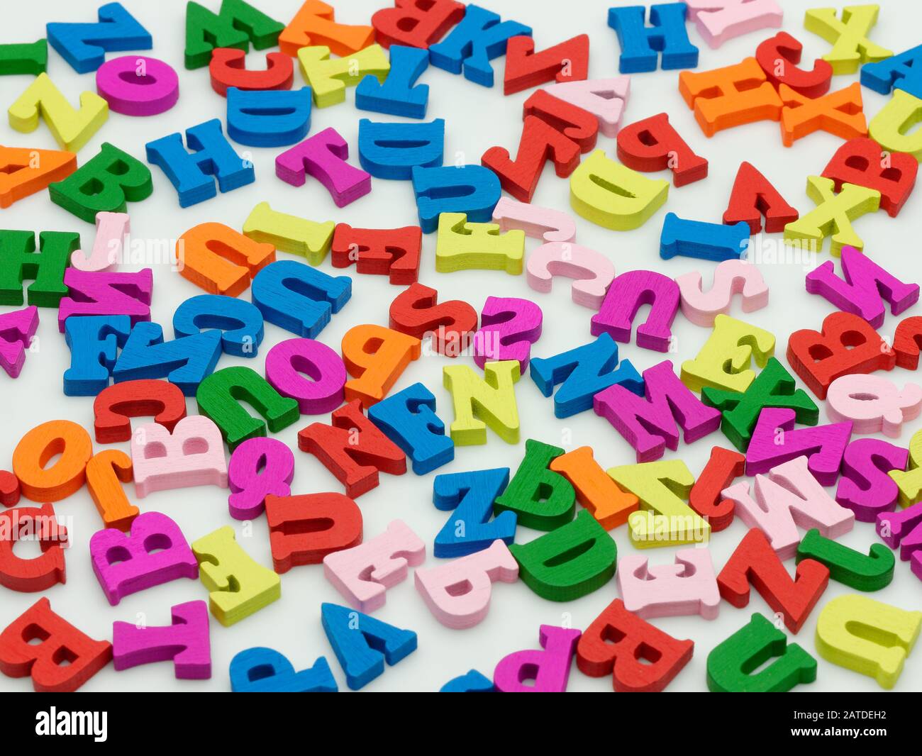 Heap of Colorful wooden letters on white background Stock Photo - Alamy