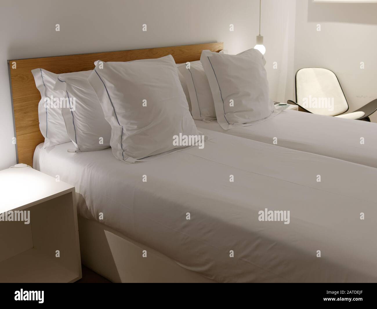 bed in hotel room for rest Stock Photo - Alamy
