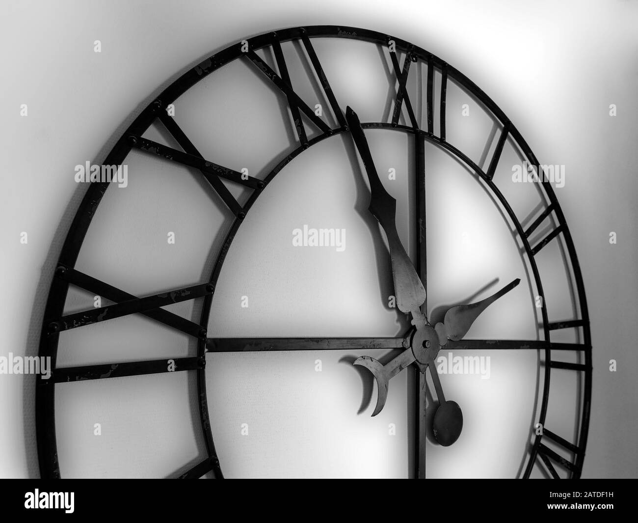 Perspective view big vintage wall clock with roman numbers Stock Photo ...