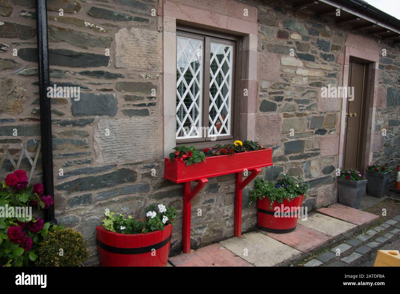 Red Window box plant pots and flowers Luss Scotland Stock Photo - Alamy