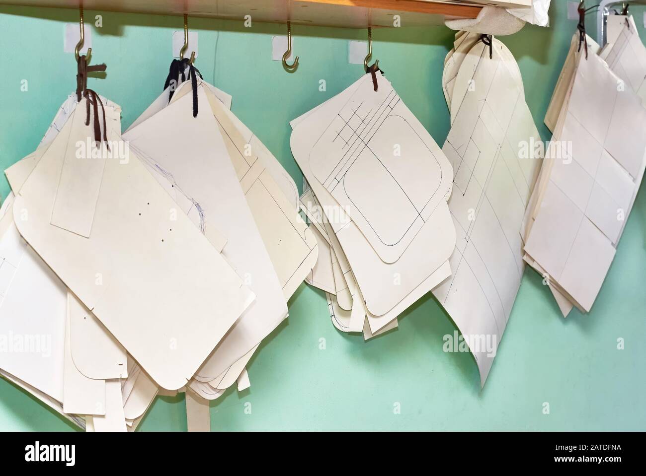 Sewing paper templates in the industrial workchop Stock Photo - Alamy
