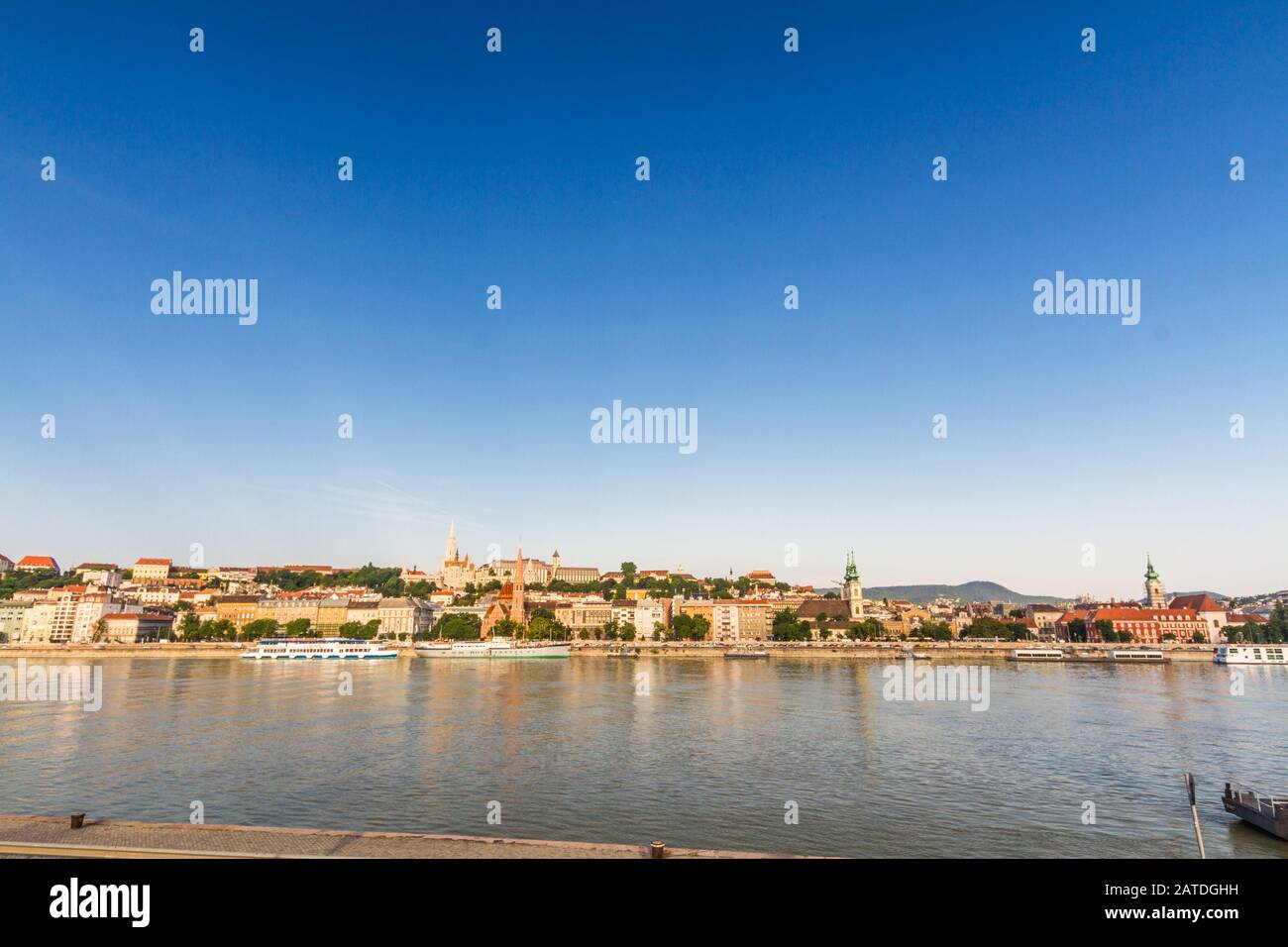 Cityscape of Buda from across the Danube in early morning sunlight ...
