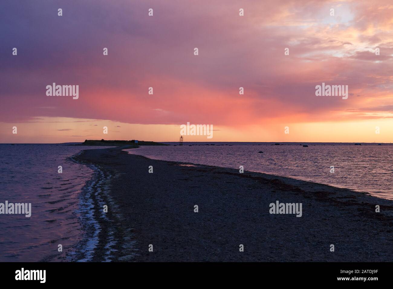 Baltic sea rocky shore at colorful sunset. Long and narrow peninsula ...