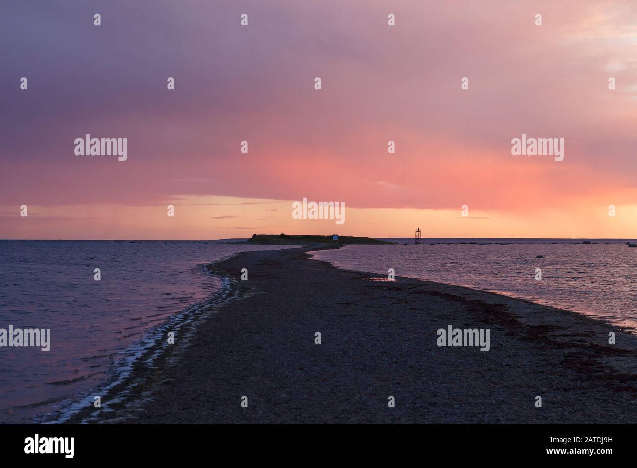 Baltic sea rocky shore at colorful sunset. Long and narrow peninsula ...